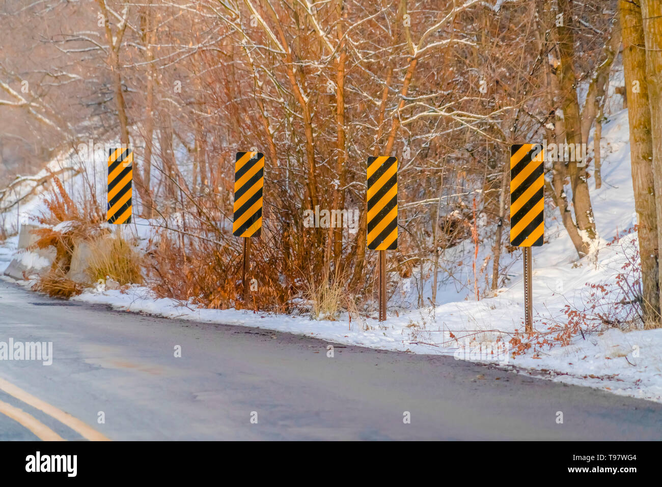 Mountain road and road signs viewed in winter Stock Photo - Alamy