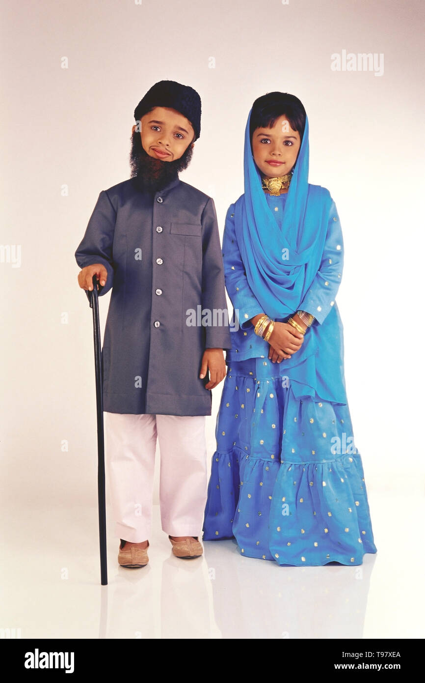 PORTRAIT OF A YOUNG BOY AND GIRL DRESSED AS MUSLIM COUPLE IN A ...