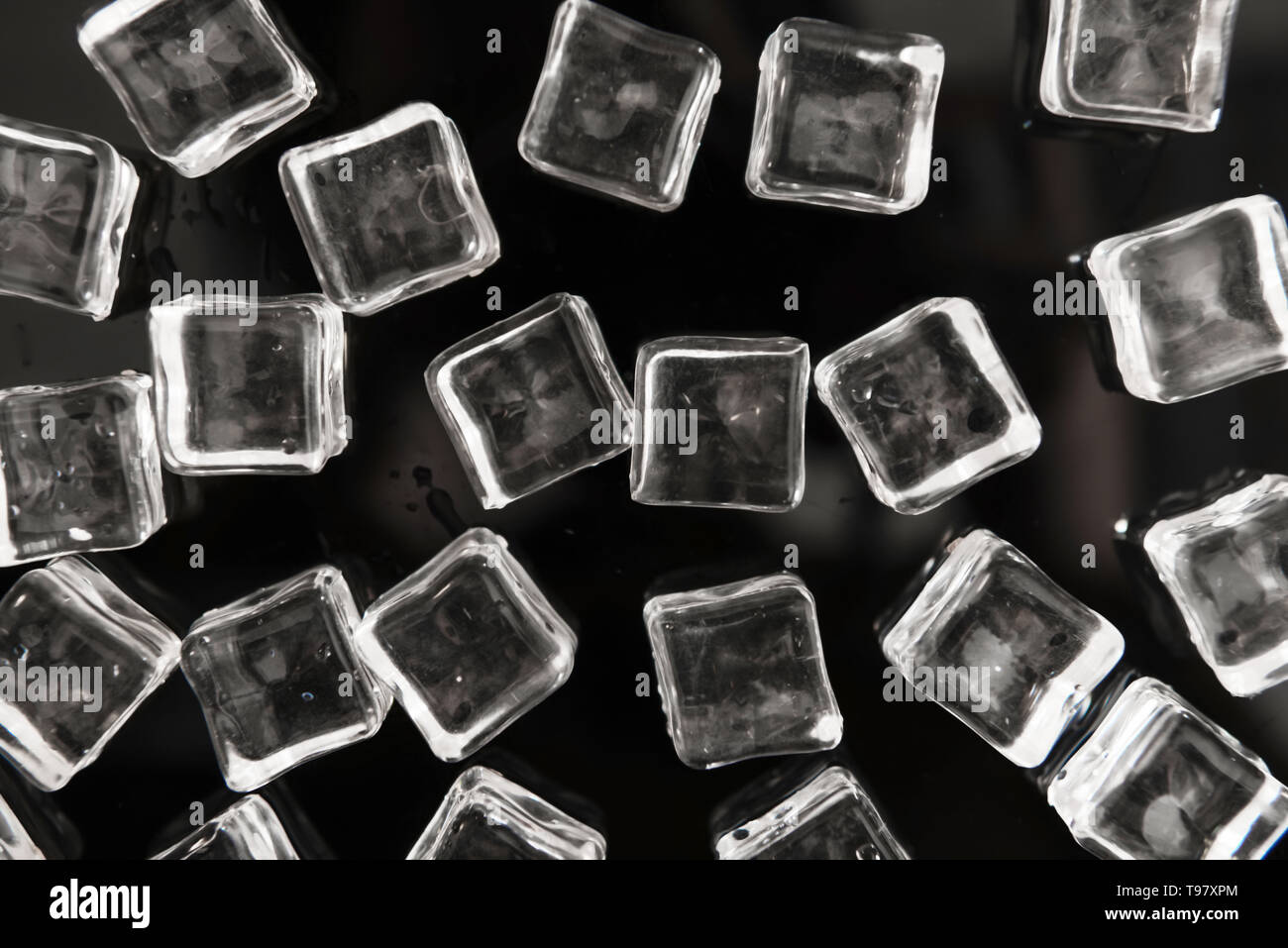Ice cubes on dark background Stock Photo - Alamy