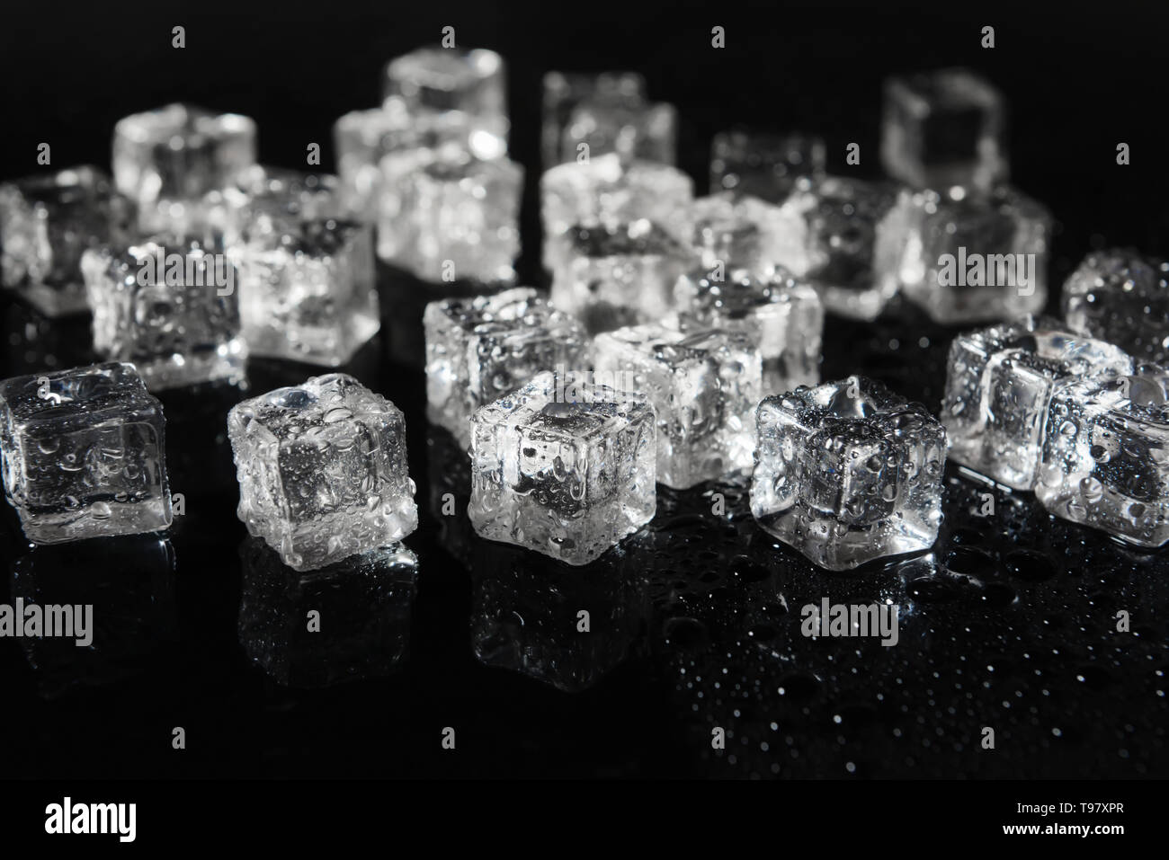 Ice cubes scattered water hi-res stock photography and images - Alamy