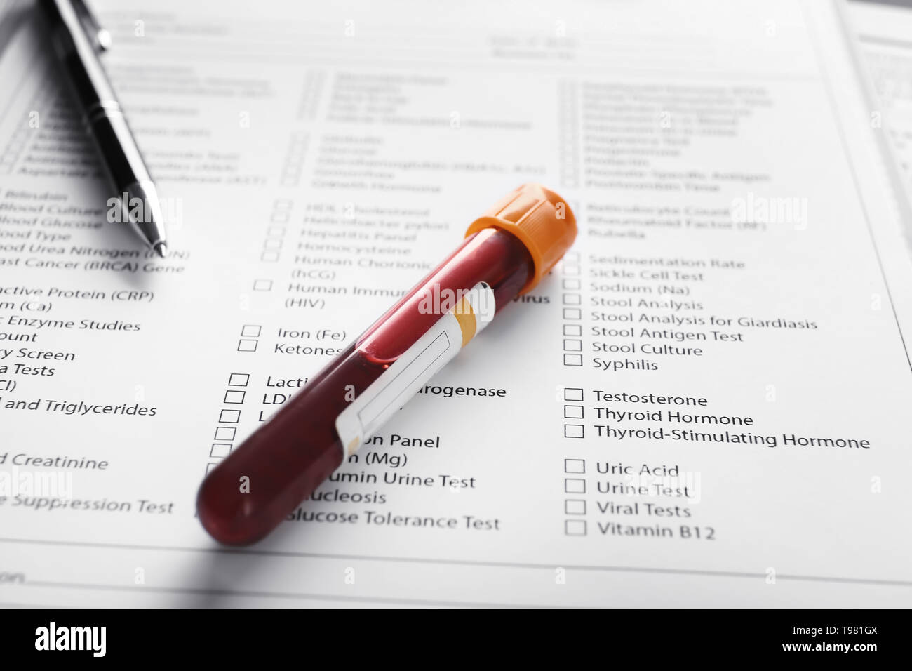 Blood sample on document with result of analyses Stock Photo - Alamy