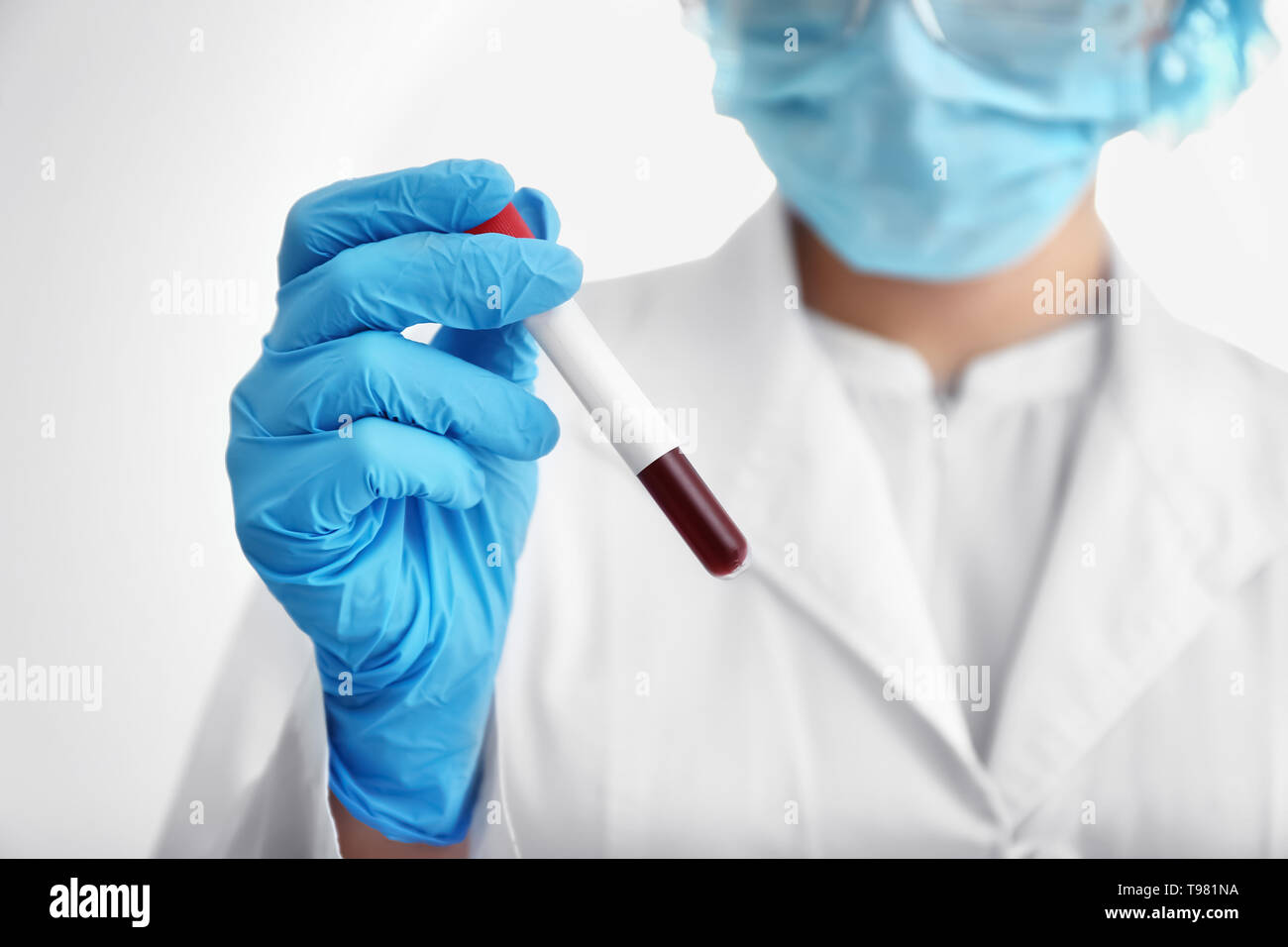 Laboratory assistant holding tube sample hi-res stock photography and ...