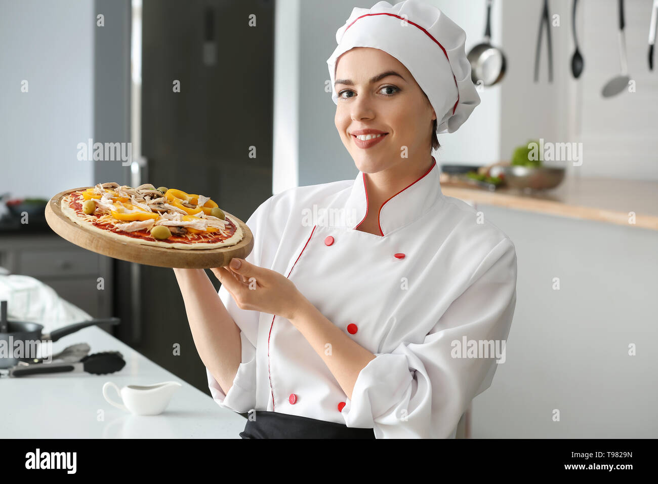 Portrait female pizza chef hi-res stock photography and images - Alamy