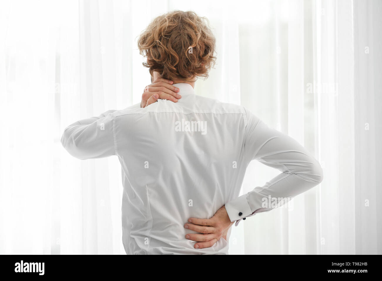 Businessman suffering from back hi-res stock photography and images - Alamy