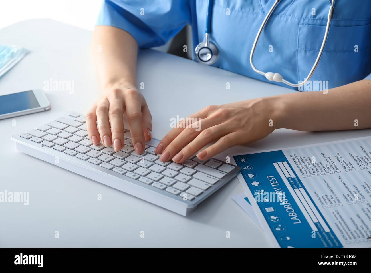 Female doctor using computer at workplace. Health care concept Stock ...