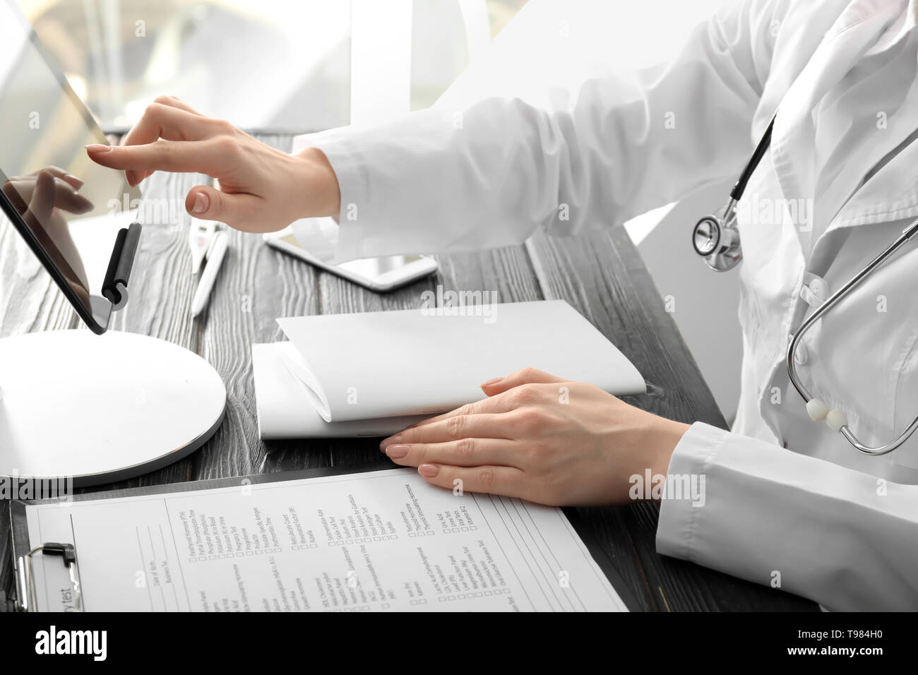 Female doctor using computer at workplace. Health care concept Stock ...