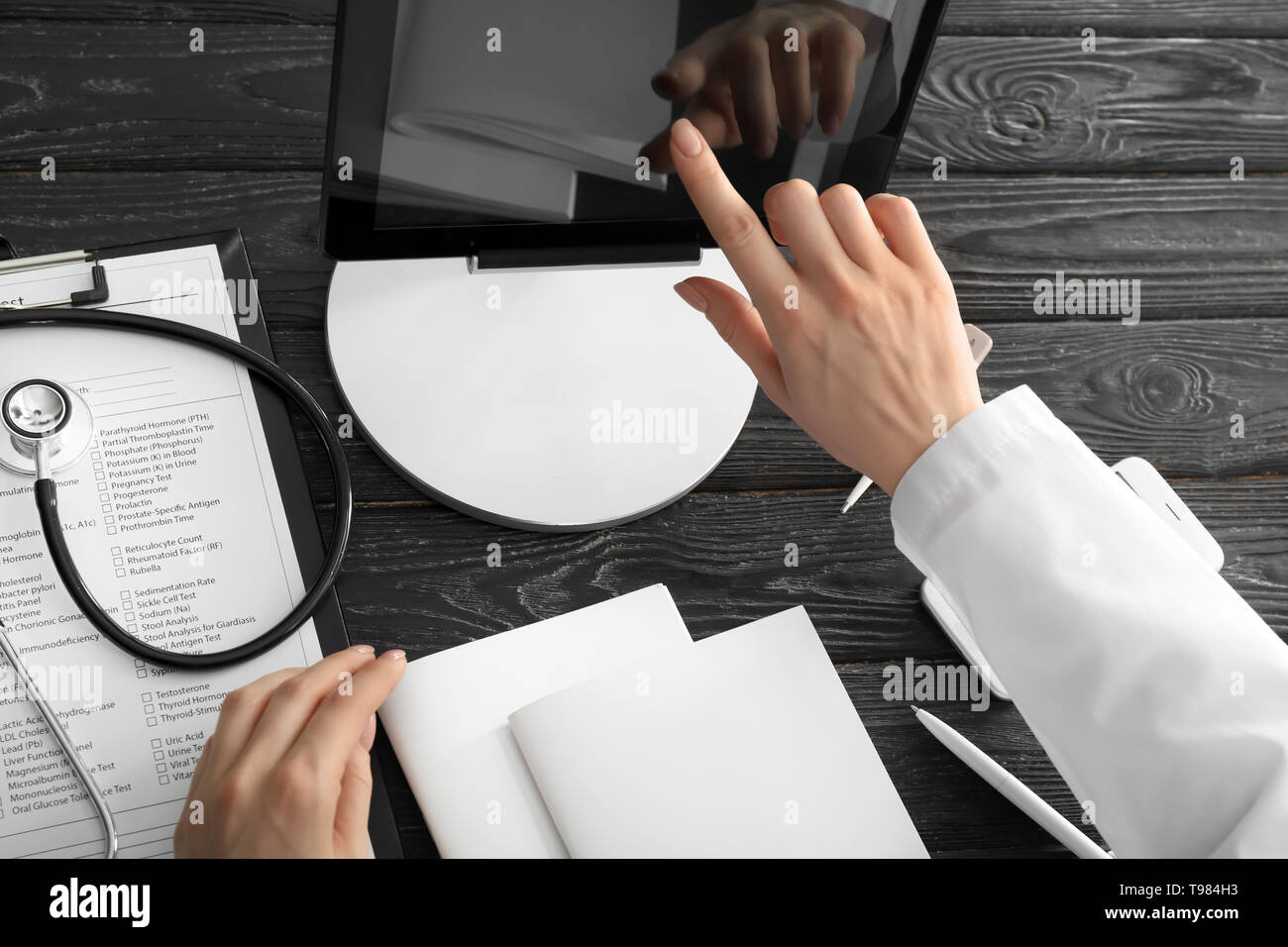 Female doctor using computer at workplace. Health care concept Stock ...