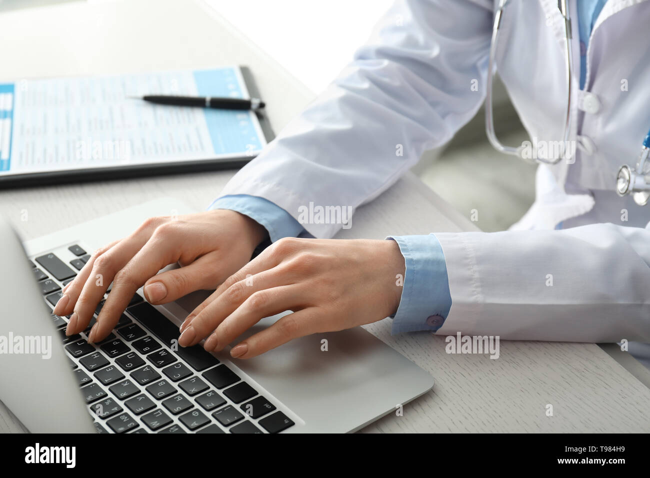 Female doctor using computer at workplace. Health care concept Stock ...