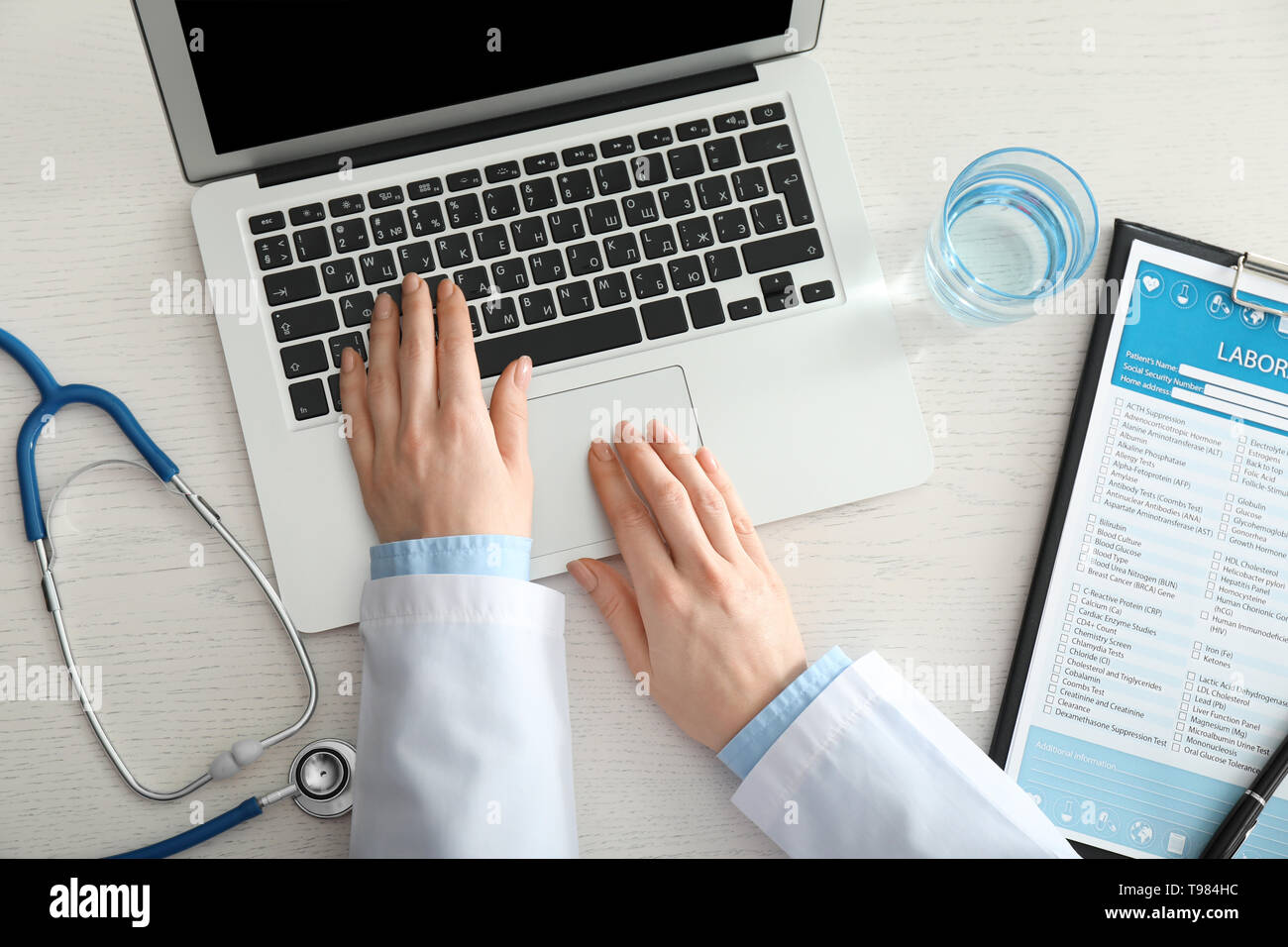 Female doctor using computer at workplace. Health care concept Stock ...