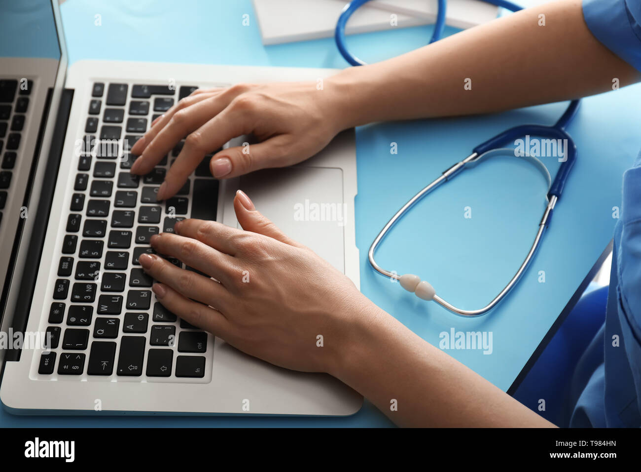 Female doctor using computer at workplace. Health care concept Stock ...