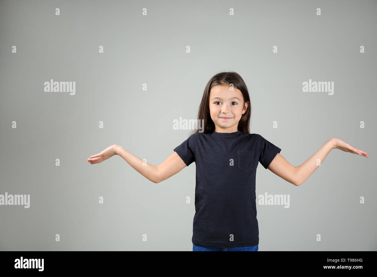Emotional girl after making mistake on light background Stock Photo - Alamy