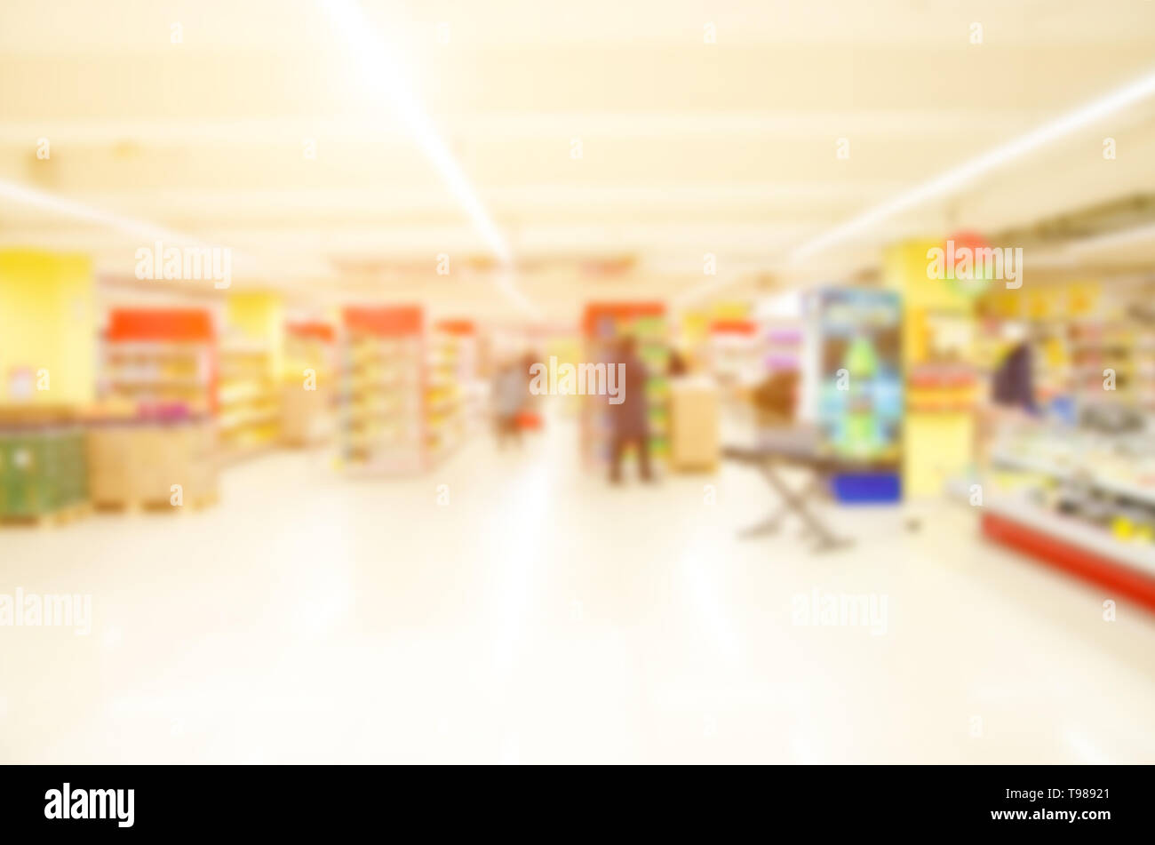 Abstract blurred supermarket aisle. Wide perspective view of empty ...