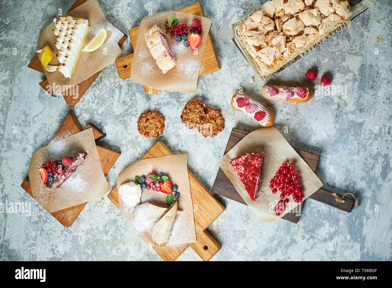 Assorted sweet desserts: cake, churos, meringue roll, ice cream ...
