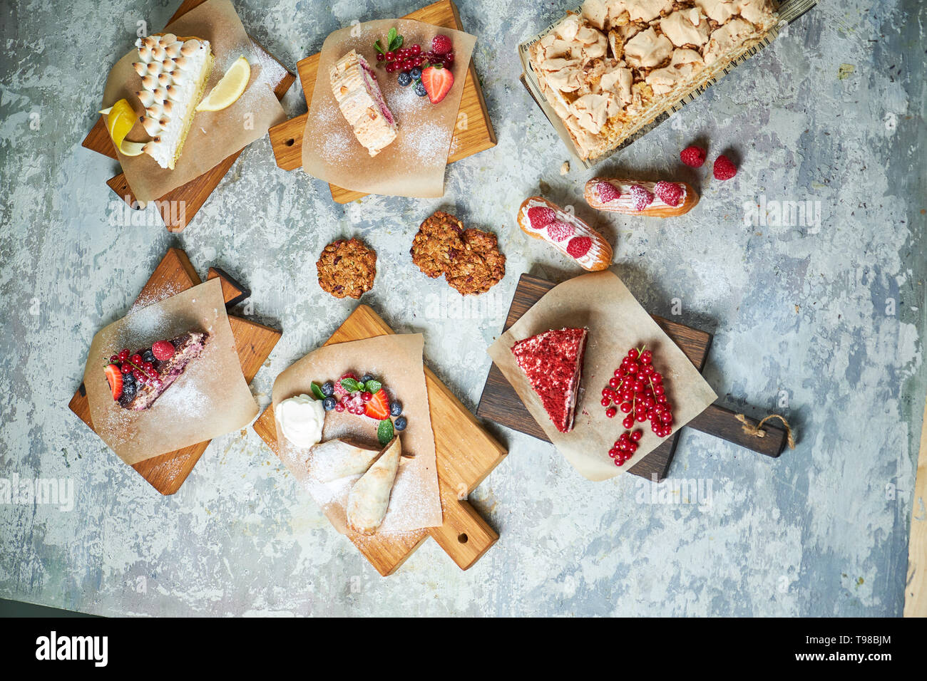 Assorted sweet desserts: cake, churos, meringue roll, ice cream ...