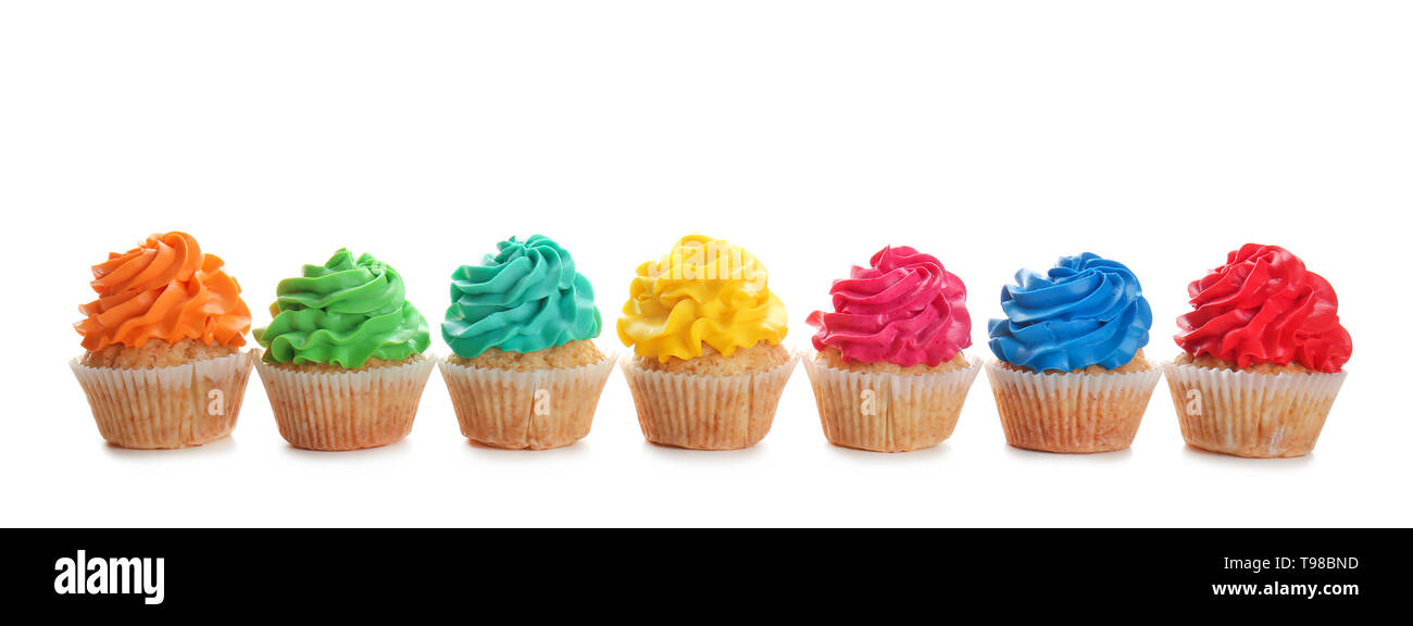 Colorful cupcakes on white background Stock Photo - Alamy