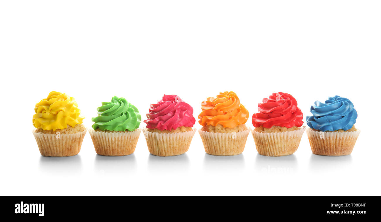 Colorful cupcakes on white background Stock Photo - Alamy
