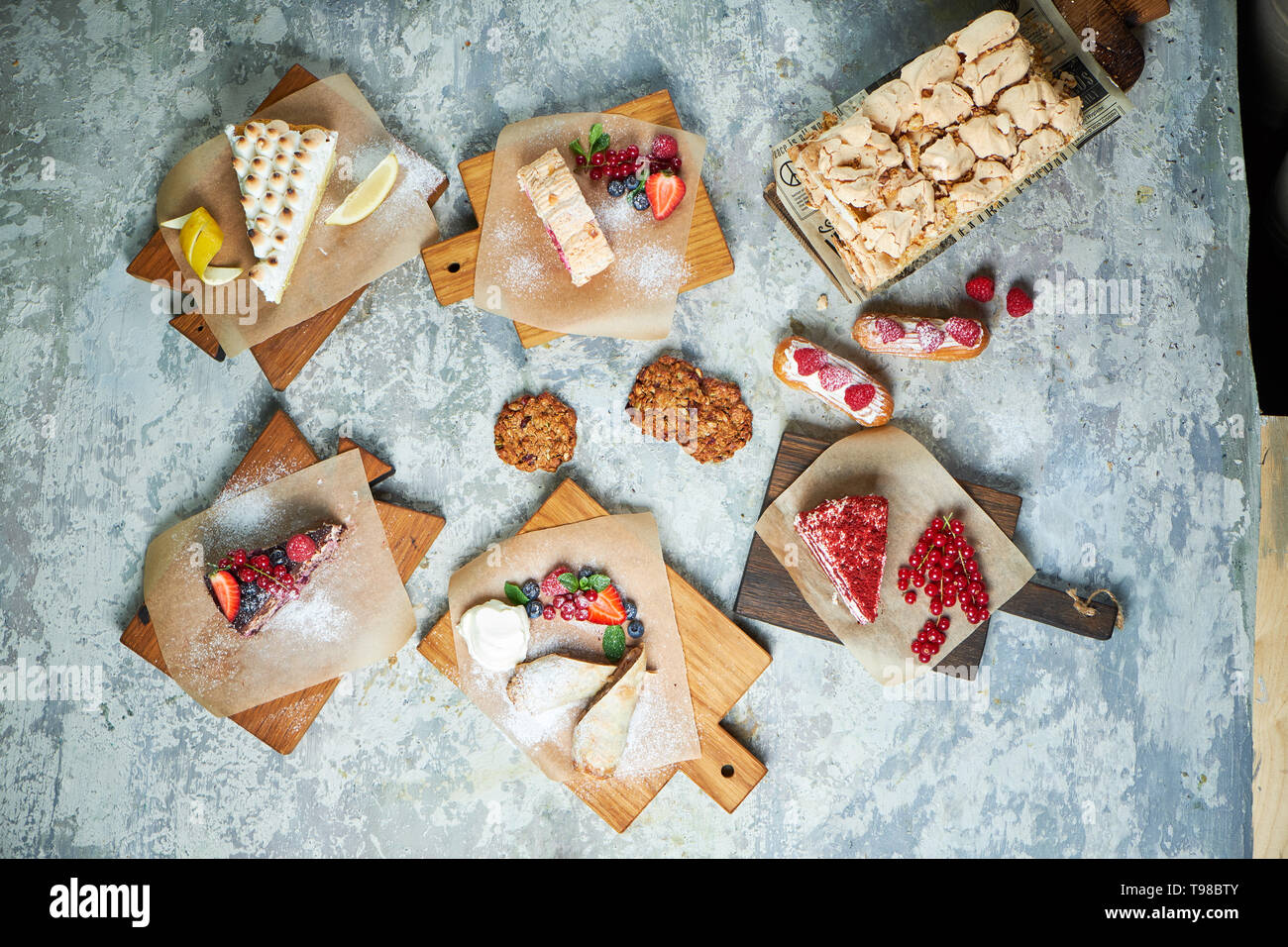 Assorted sweet desserts: cake, churos, meringue roll, ice cream ...