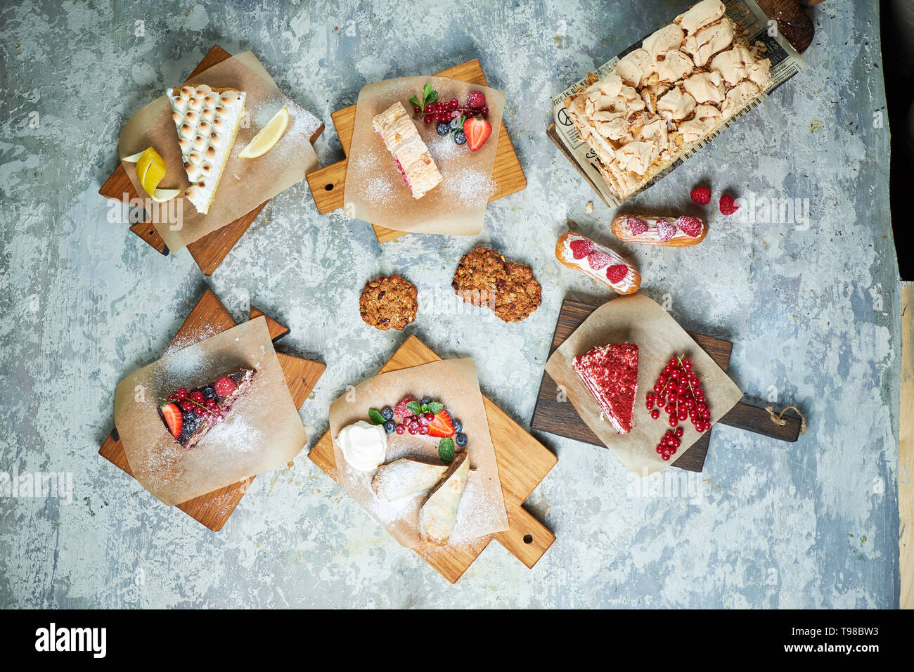 Assorted sweet desserts: cake, churos, meringue roll, ice cream ...