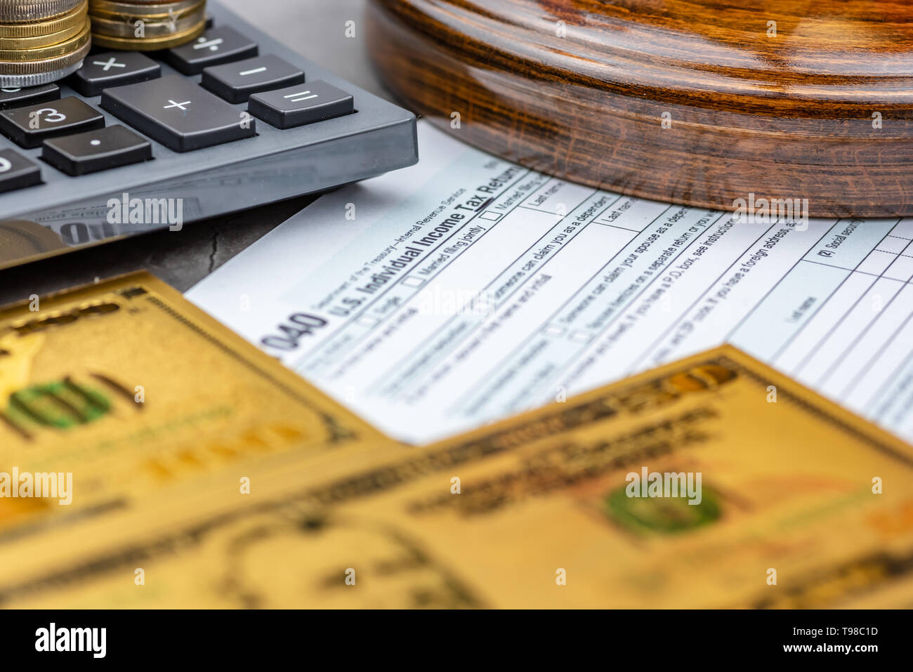 Pencil over tax paper to fill and banknotes around.Tax paying concept ...