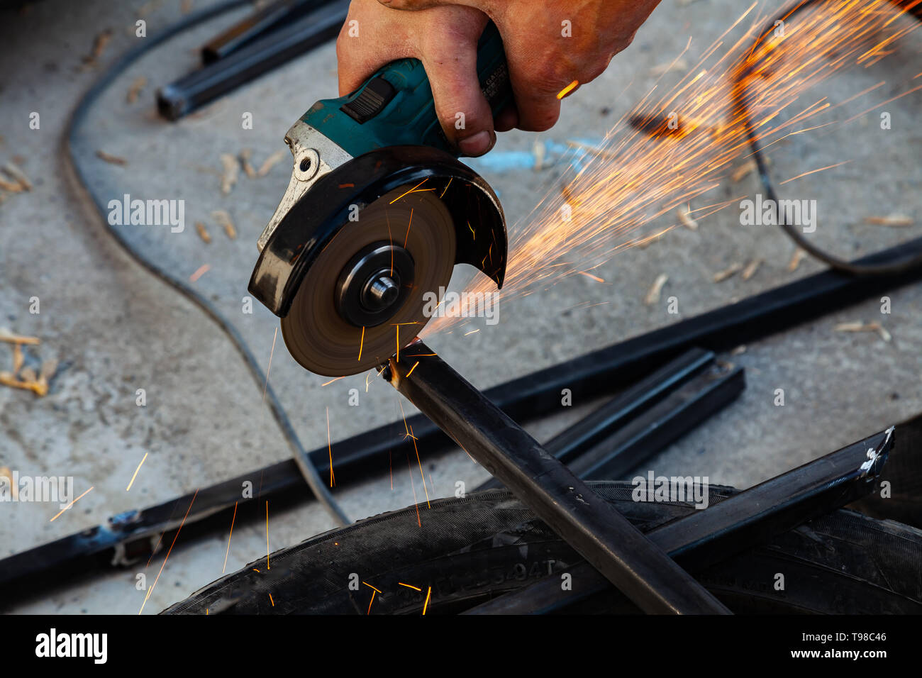 Man performs grinding work factory hi-res stock photography and images ...