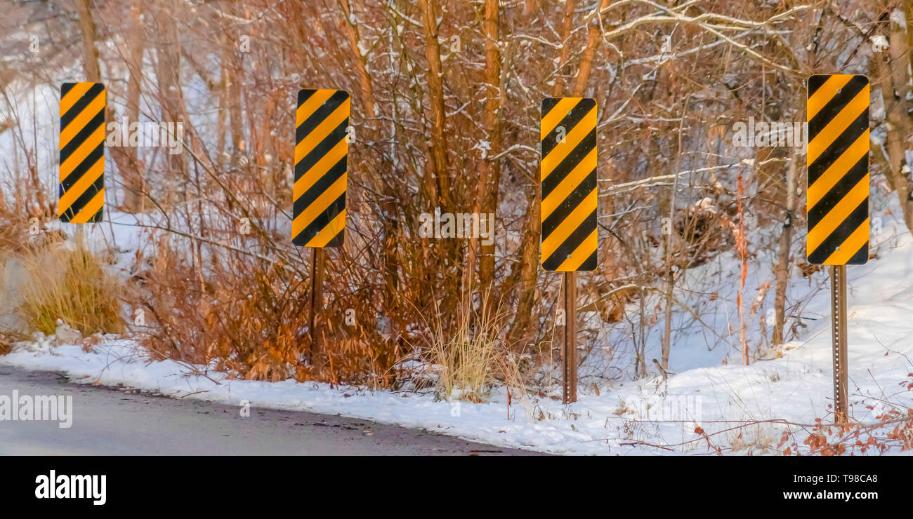 Panorama Mountain road and road signs viewed in winter Stock Photo - Alamy