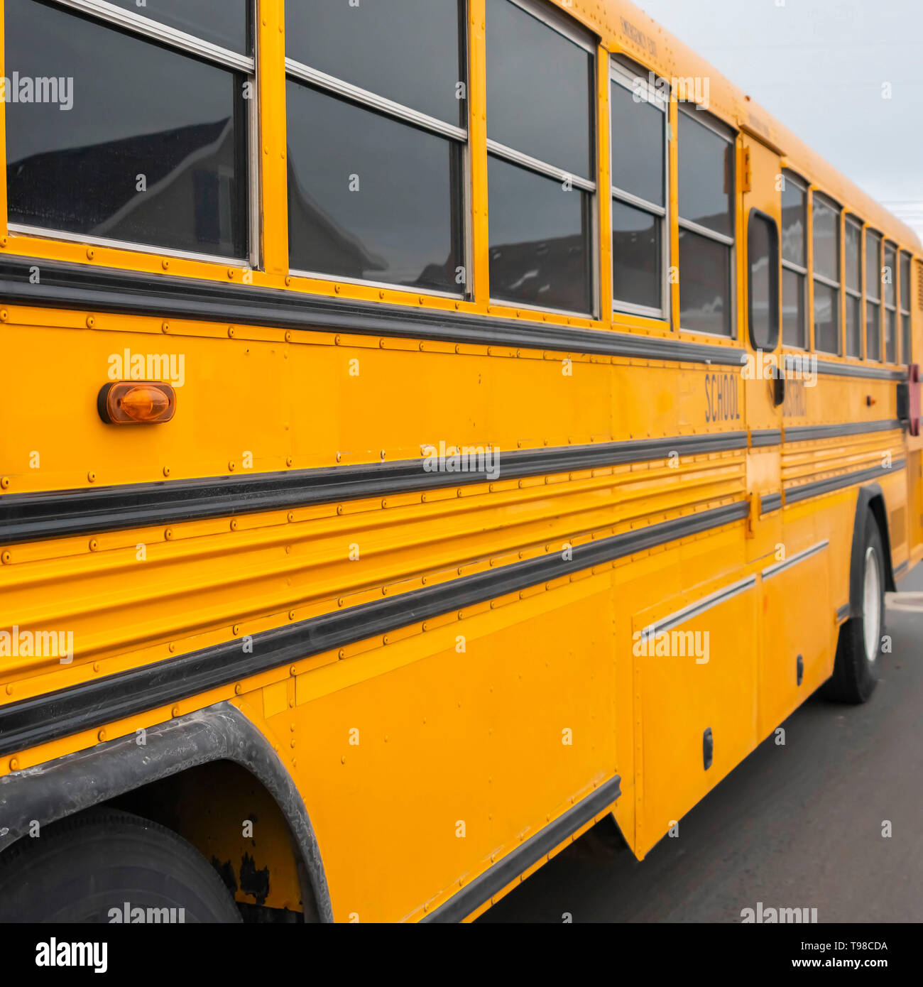 Clear Square Exterior view of a yellow school bus with a red stop sign ...