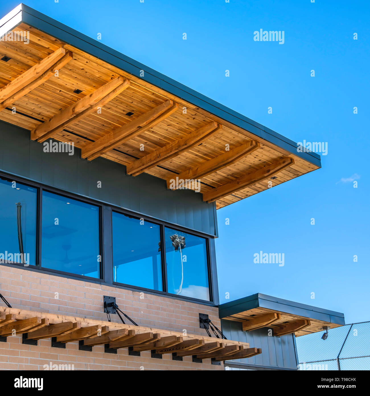 Square Exterior of a brick building with flat roof and large glass ...