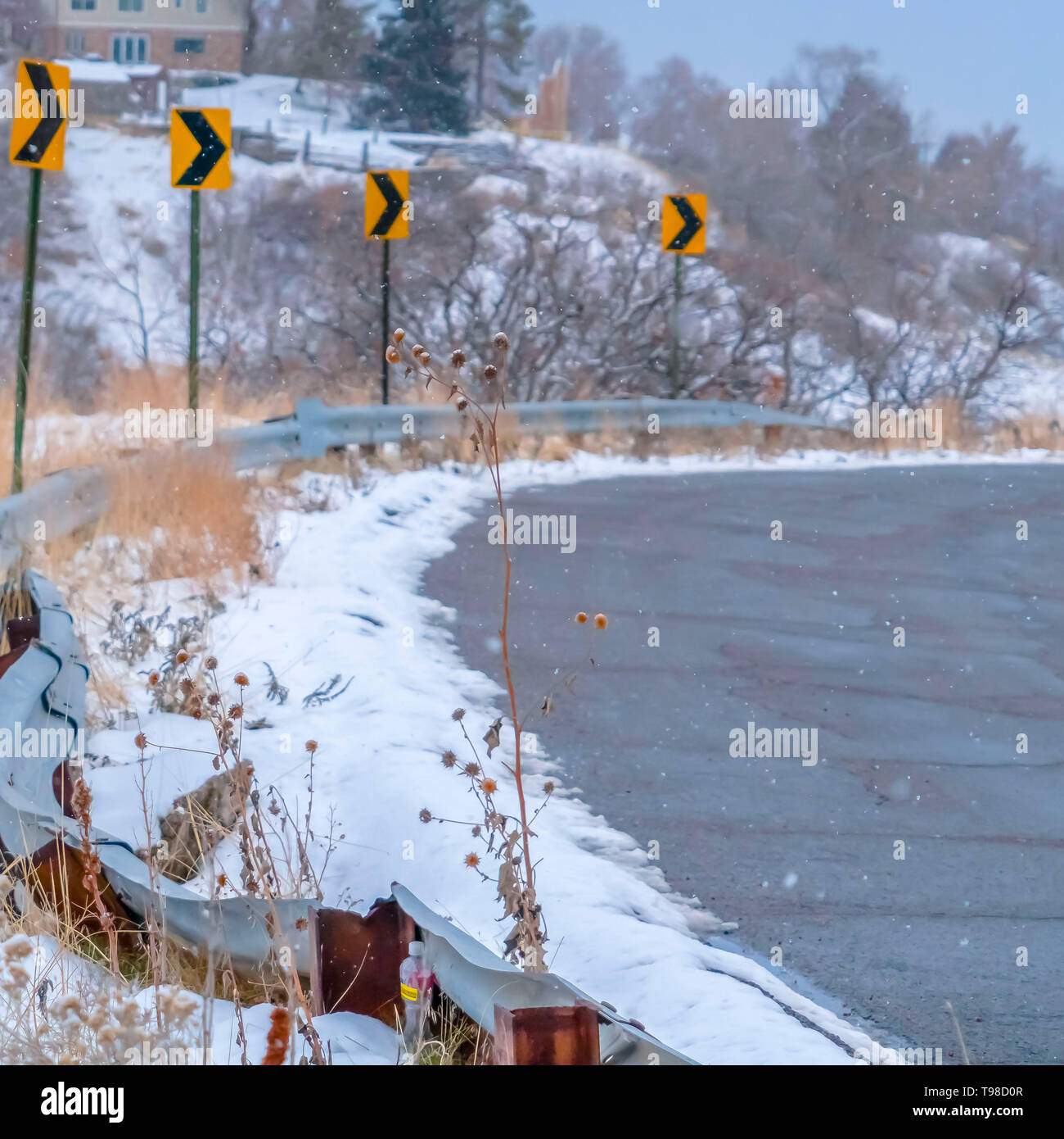 Square Directional road signs on mountain road in winter Stock Photo ...