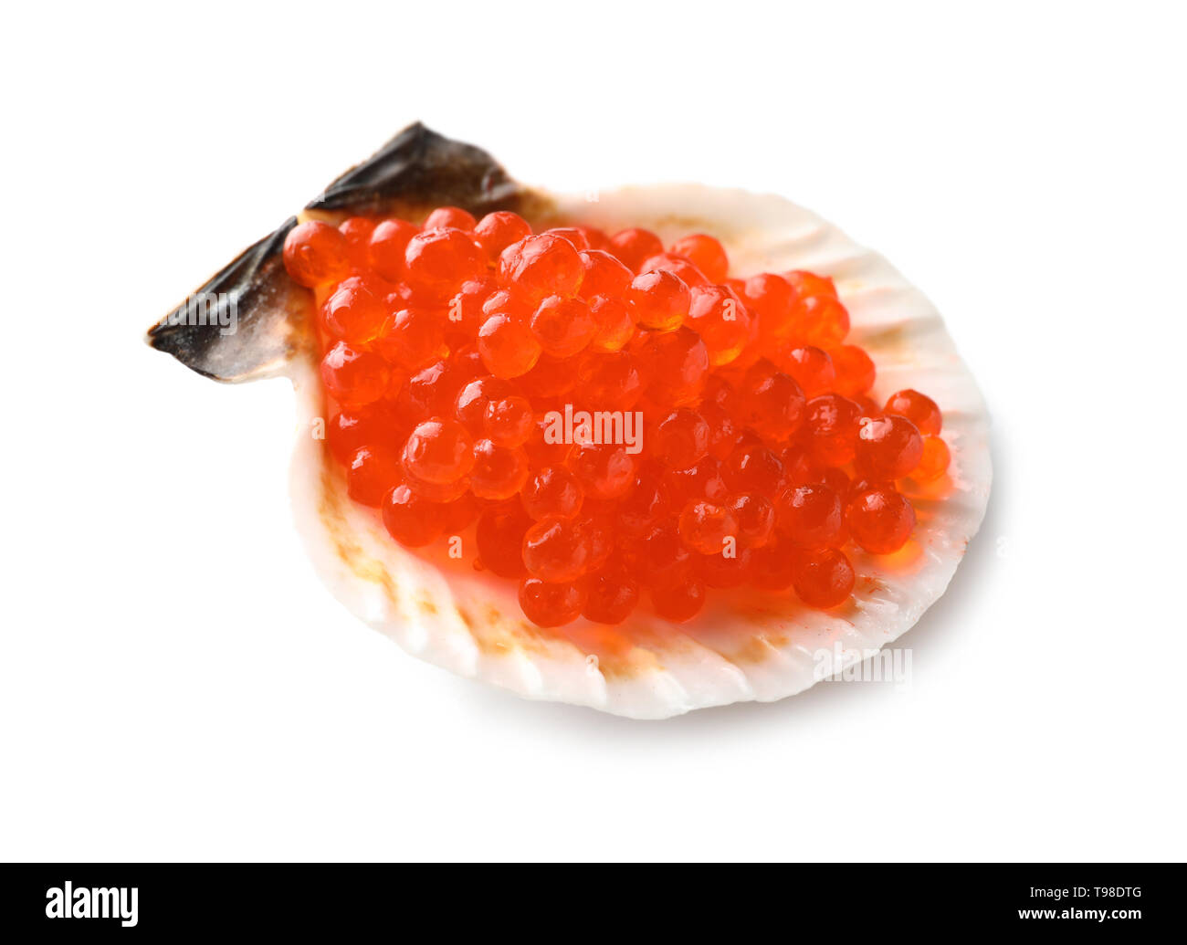Sea shell with delicious red caviar on white background Stock Photo - Alamy