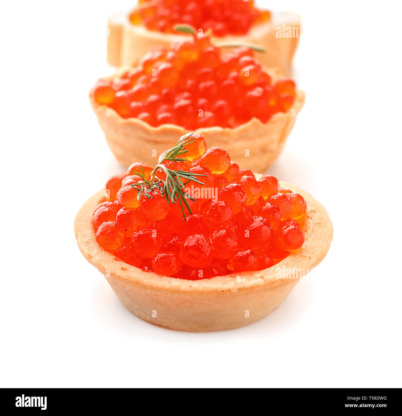 Delicious canapes with red caviar on white background Stock Photo - Alamy