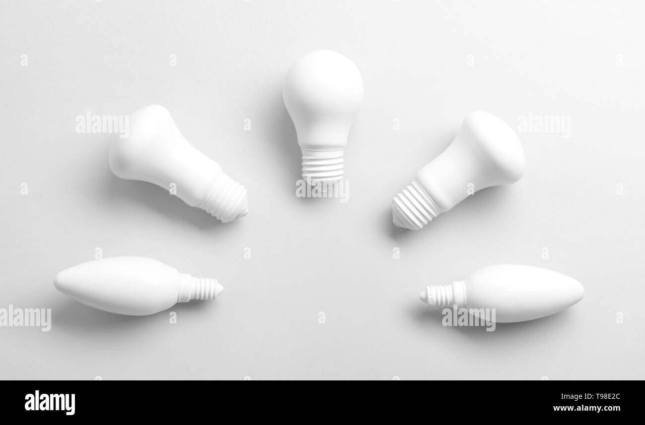 Different light bulbs on white background Stock Photo - Alamy
