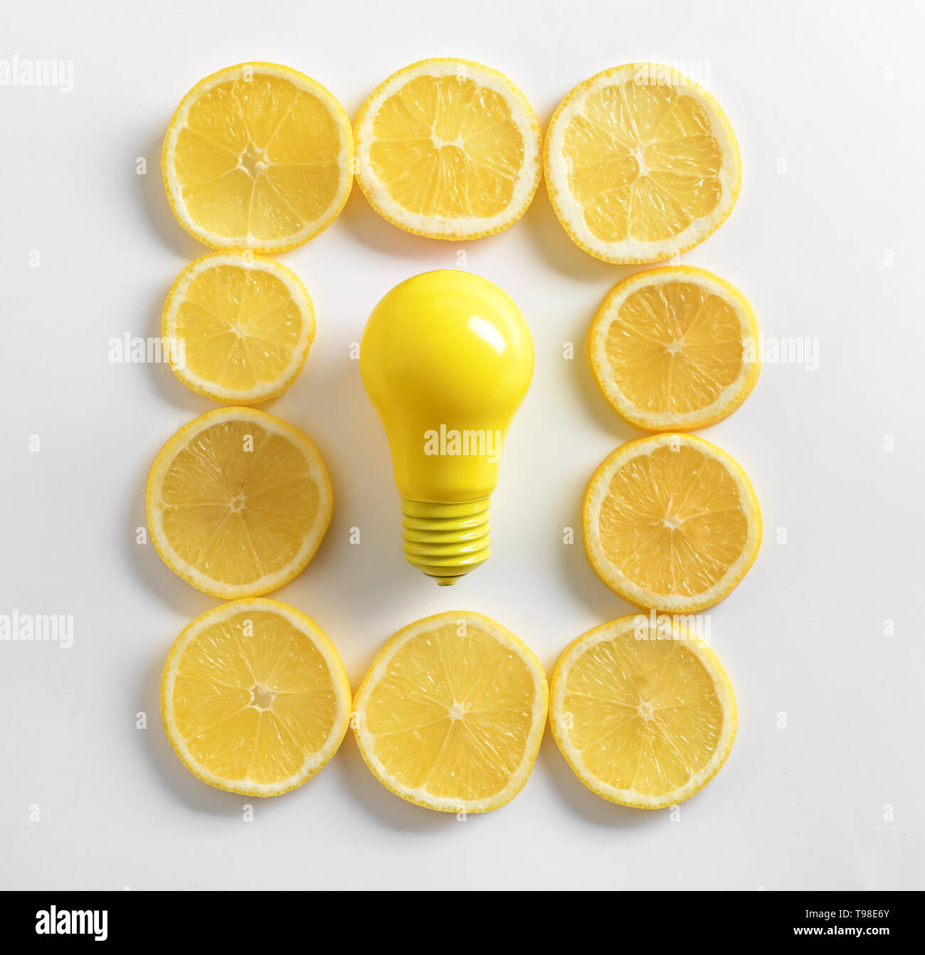 Painted light bulb with lemon slices on white background Stock Photo ...