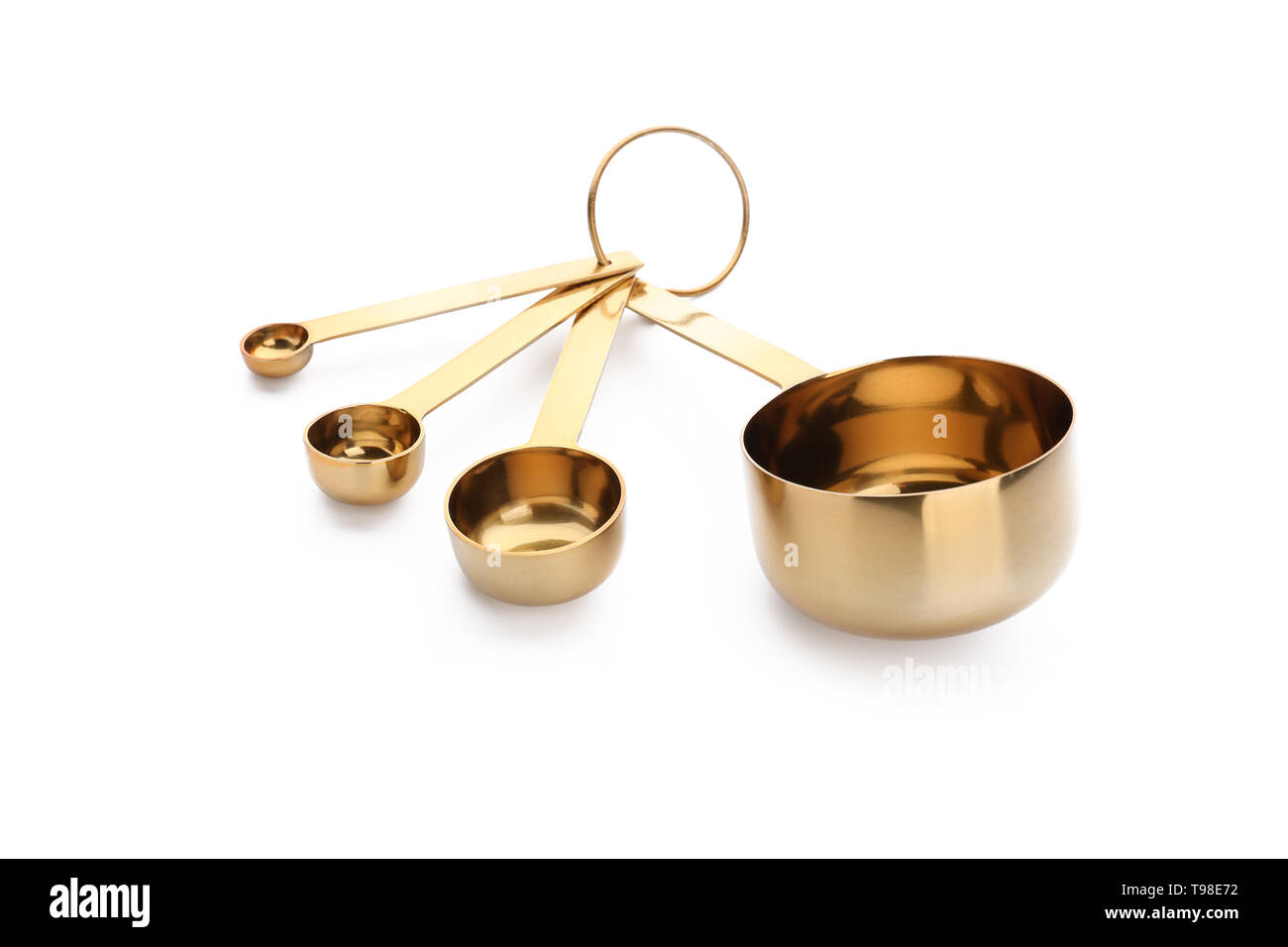 Different metal scoops on white background Stock Photo - Alamy