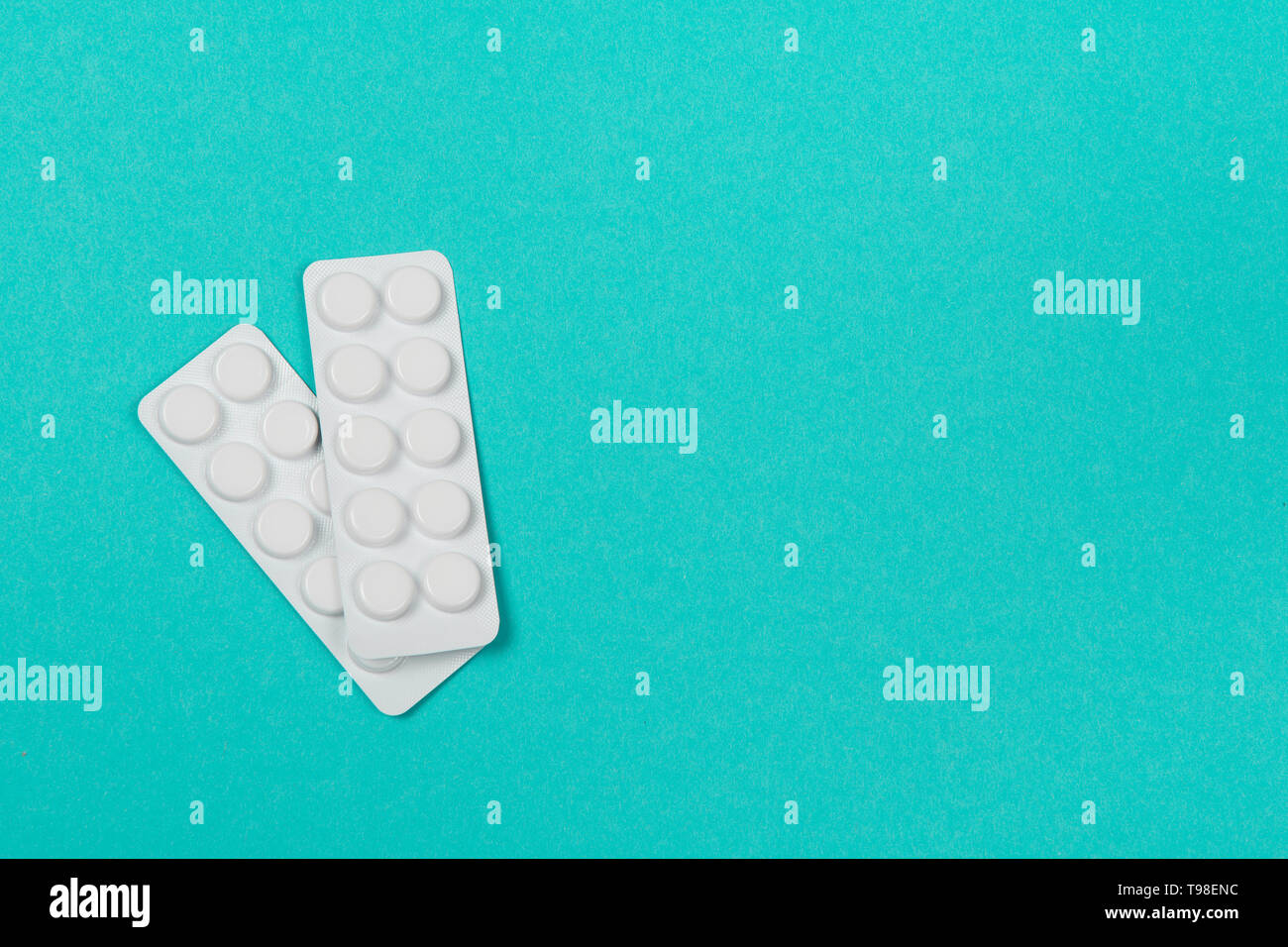 Two medicine tablet strips on a blue background with copy space Stock ...
