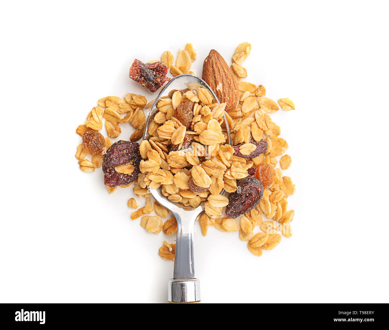 Spoon with granola on white background Stock Photo - Alamy