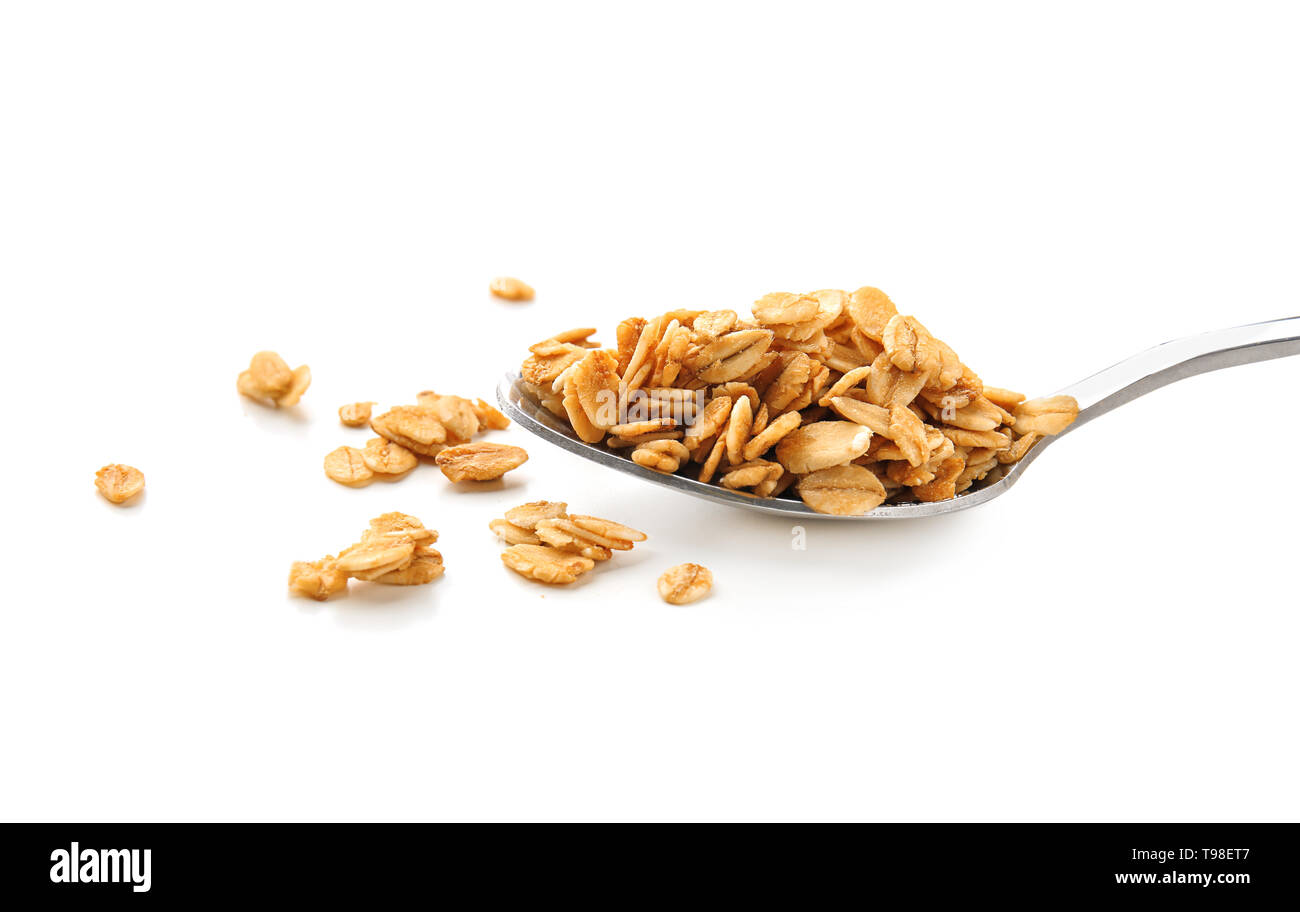 Spoon with granola on white background Stock Photo - Alamy