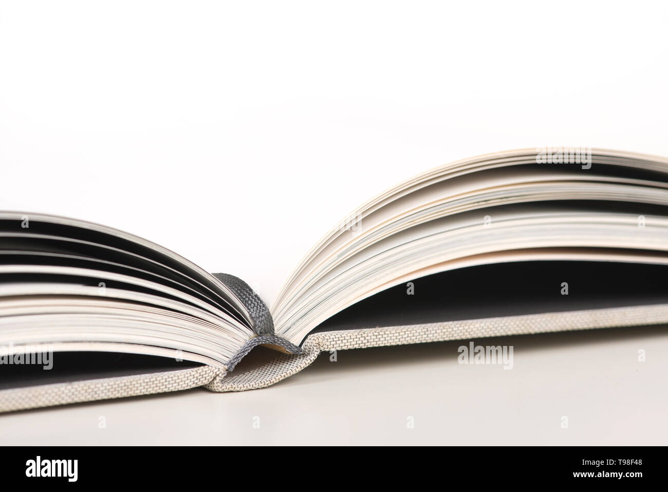 Close up of a white open book with empty pages with space for copy ...
