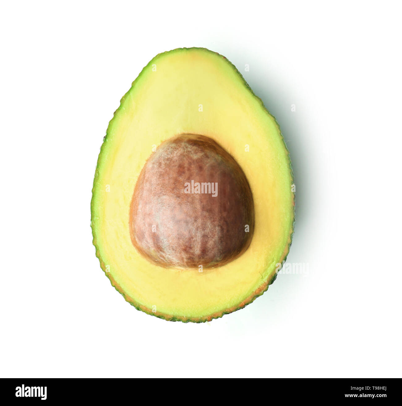 Half of ripe fresh avocado on white background Stock Photo - Alamy