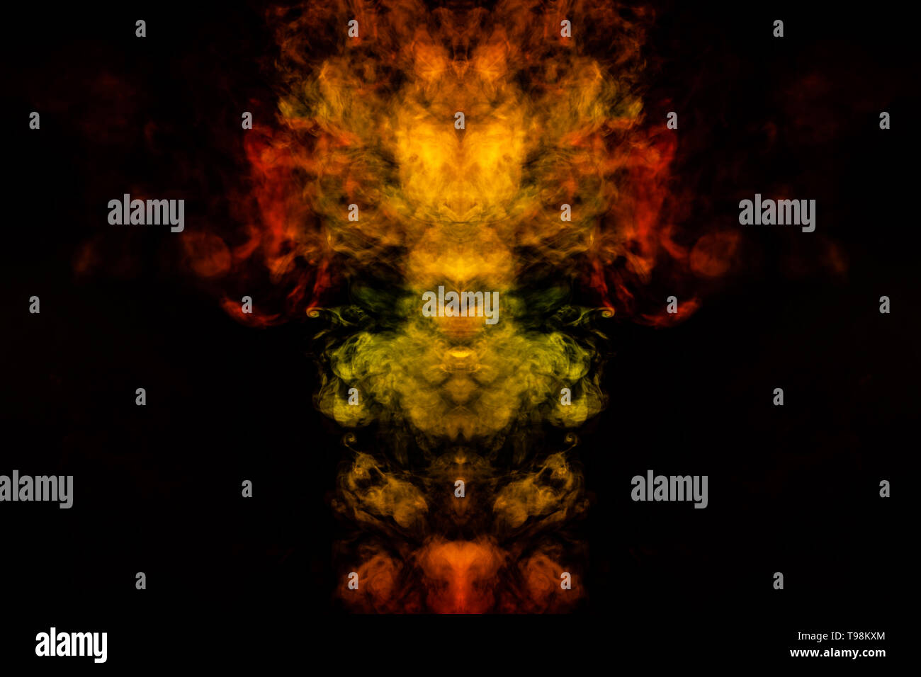Abstract image of smoke of different green, yellow, orange and red ...