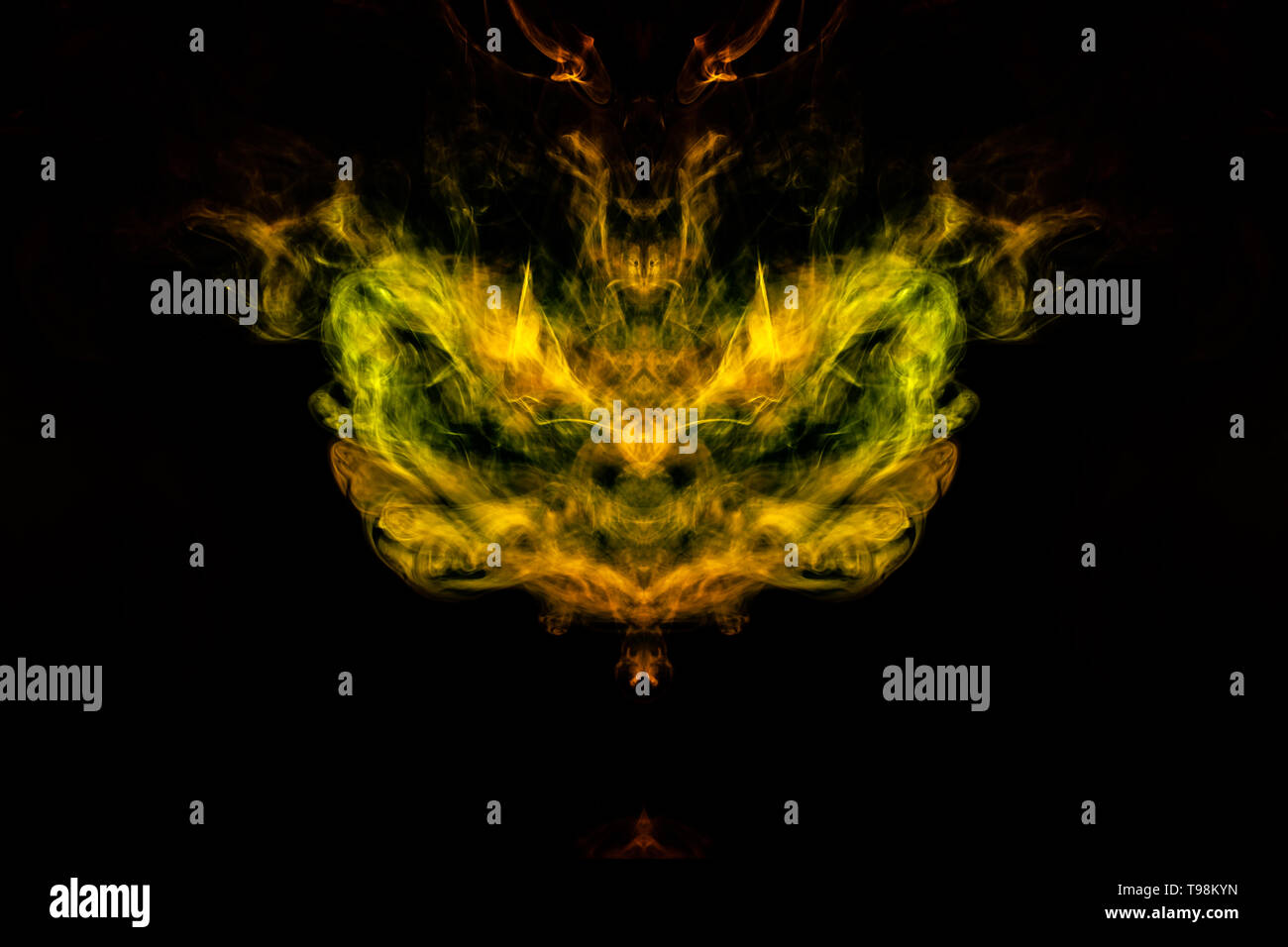 Smoke of different green, yellow, orange and red colors in the form of ...