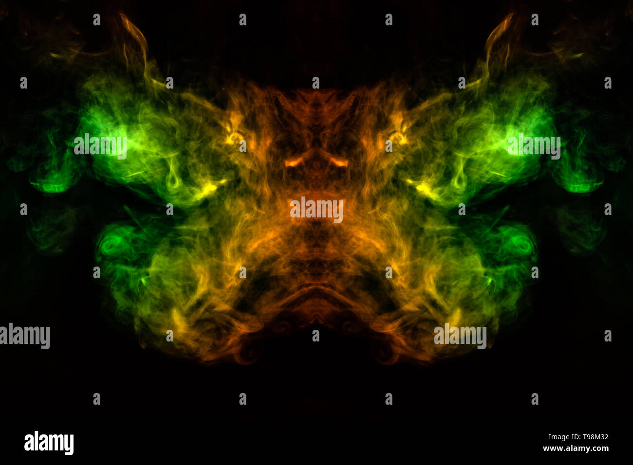 Smoke of different green, yellow, orange and red colors in the form of ...