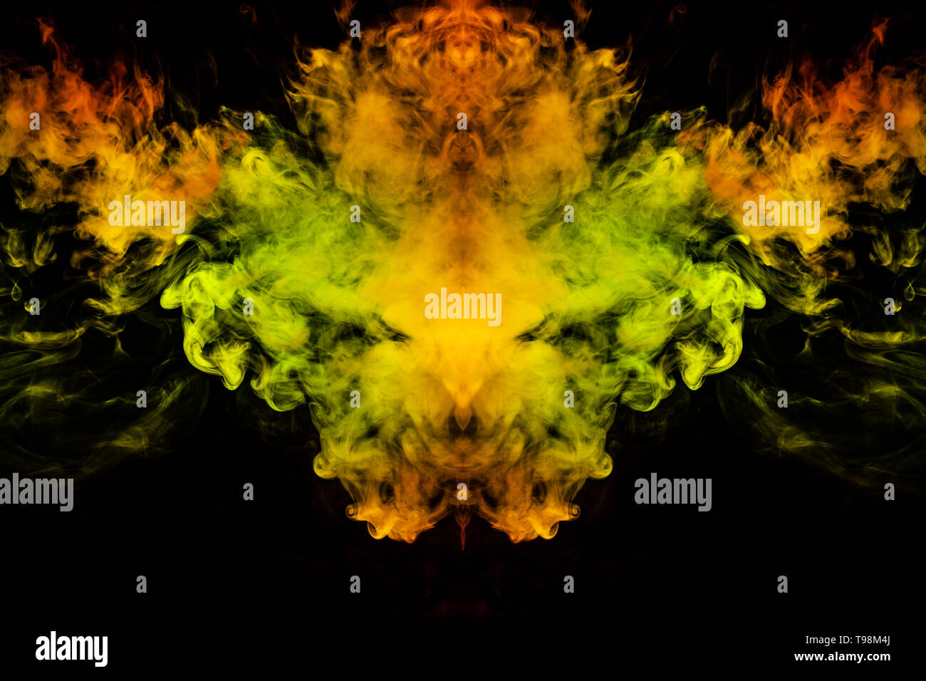 Smoke of different green, yellow, orange and red colors in the form of ...