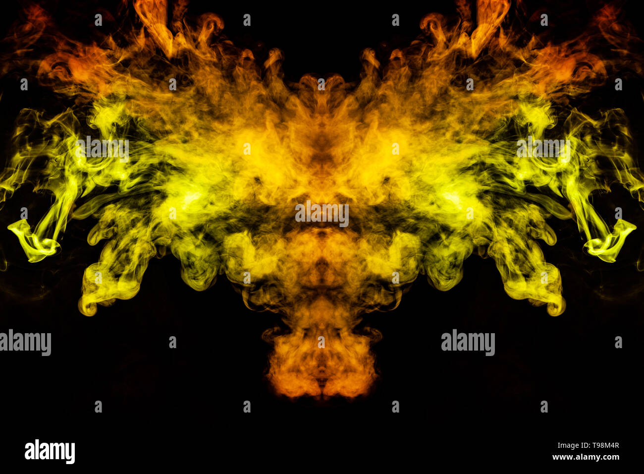 Smoke of different green, yellow, orange and red colors in the form of ...