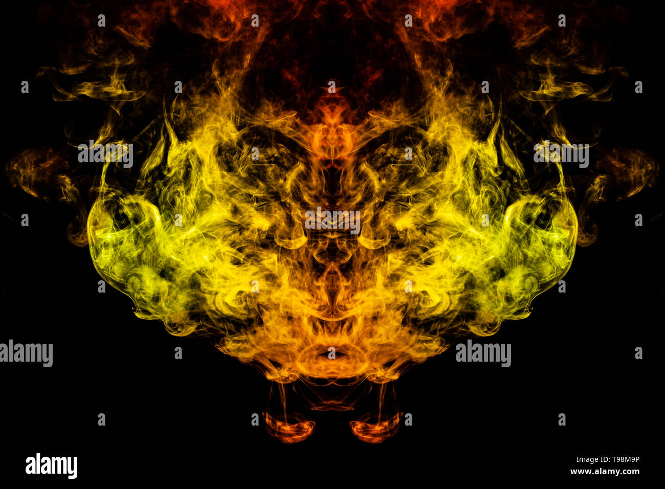 Smoke of different green, yellow, orange and red colors in the form of ...