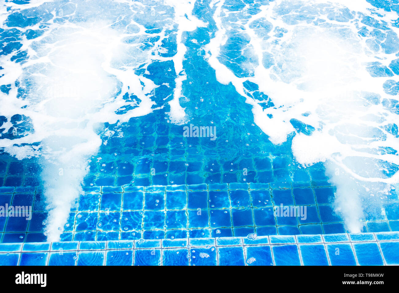 Jacuzzi swimming pool with bubbles blue water for massage and spa Stock ...