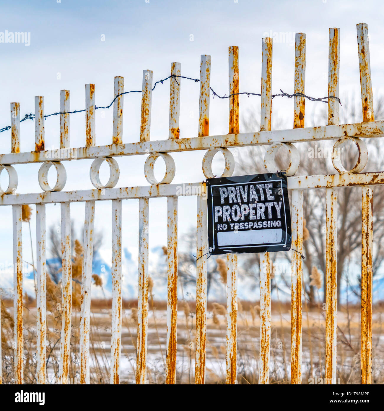 Clear Square Private Property No Trespassing sign on a rusty gate with ...