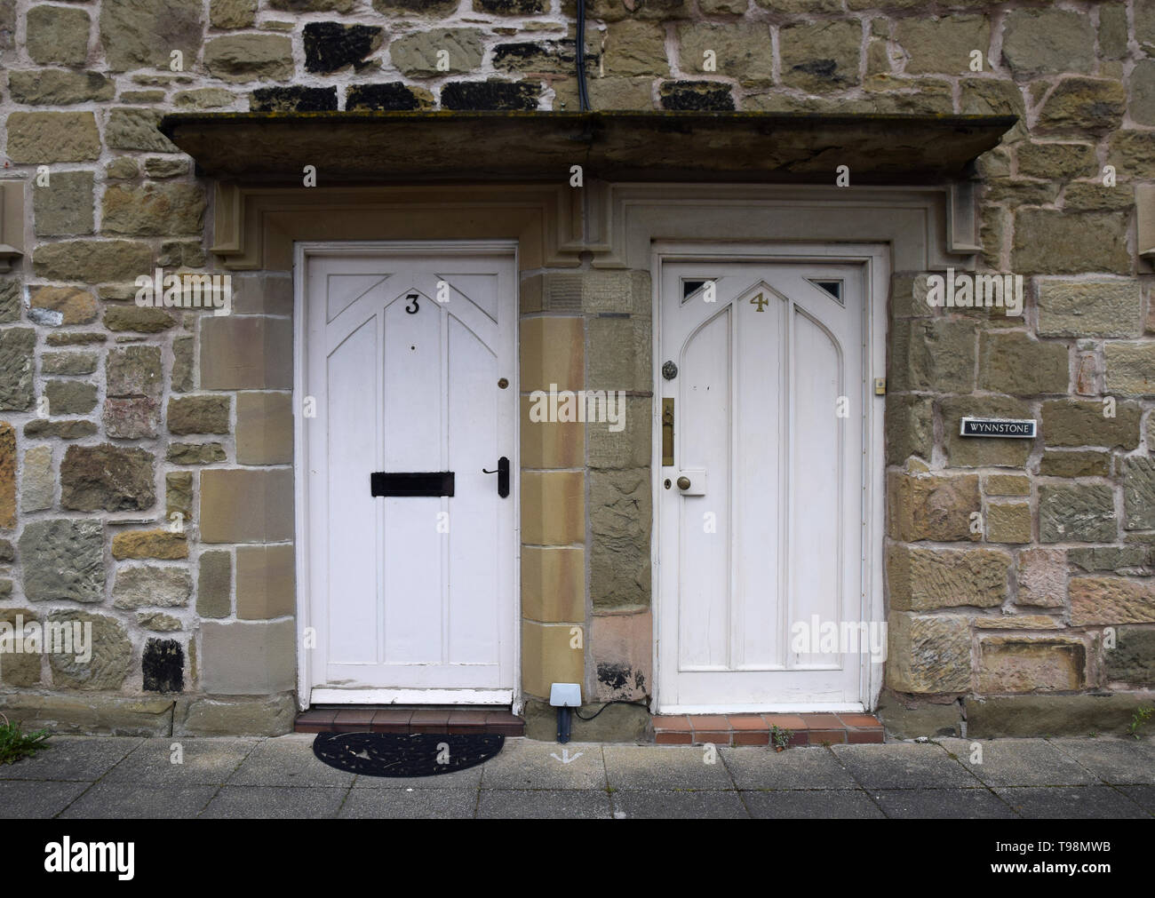 white painted wooden doors, overton, wales, britain Stock Photo - Alamy
