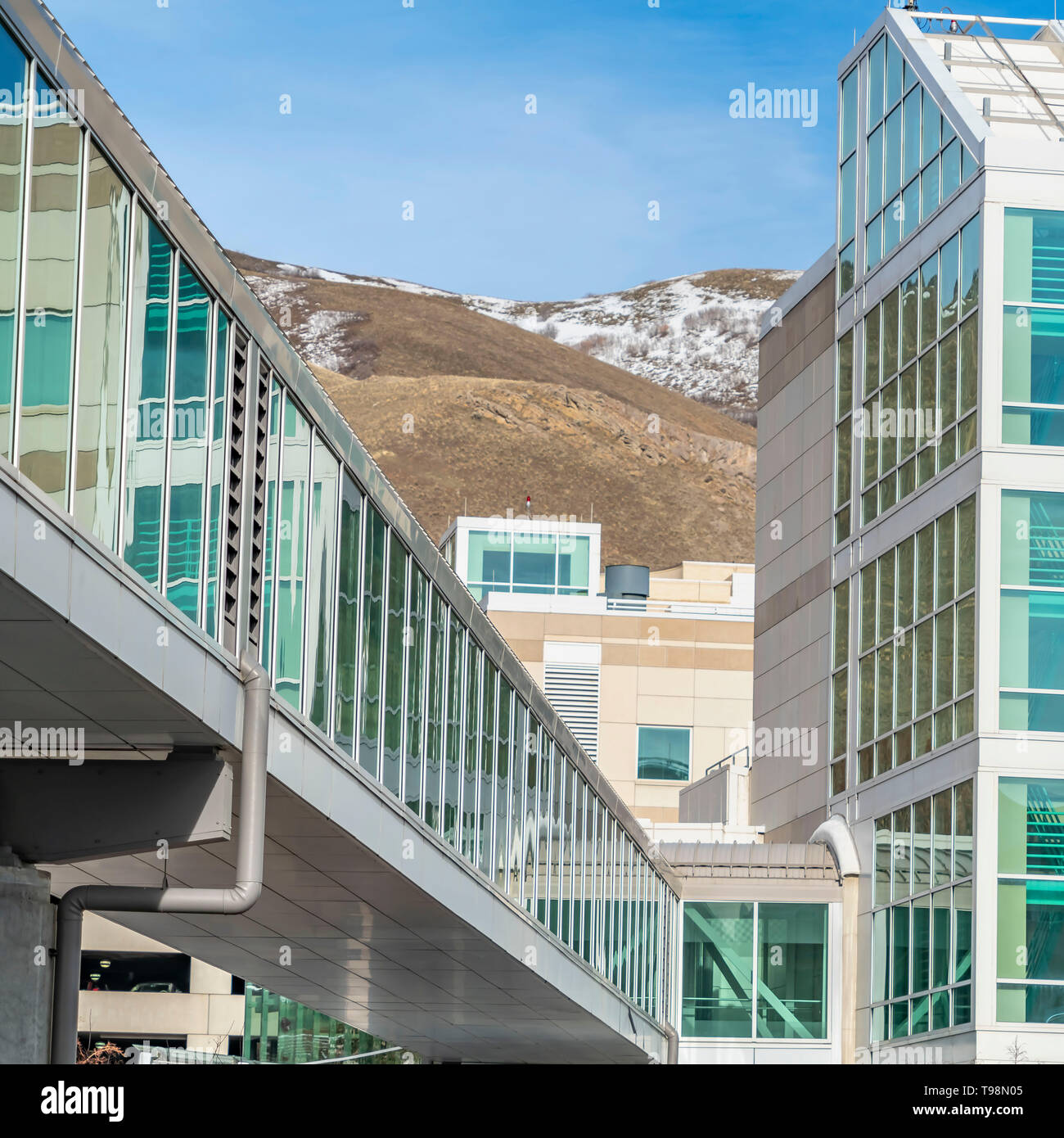Clear Square Sunny day view of a modern building exterior with a glass ...