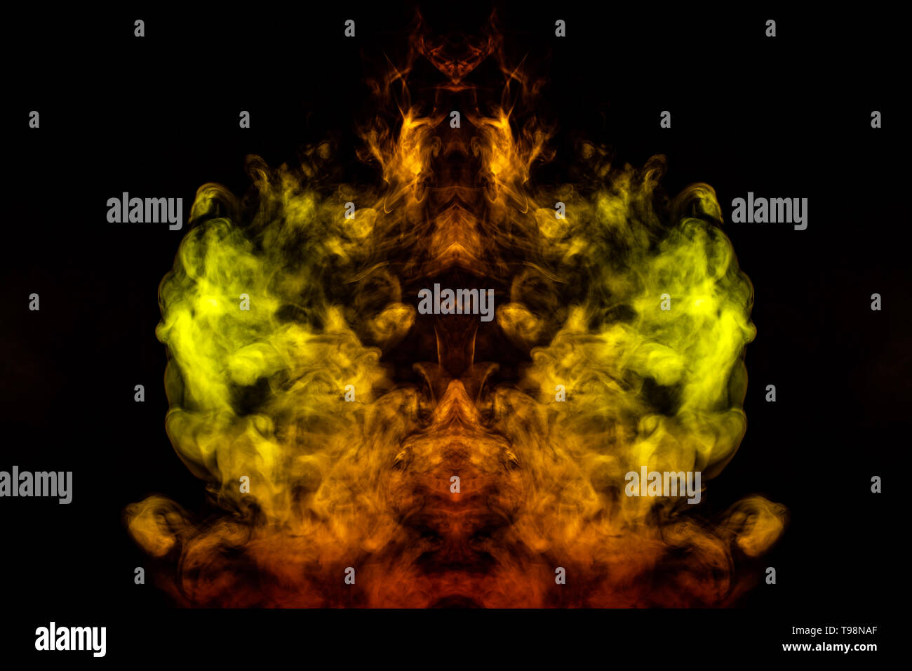 Abstract image of smoke of different green, yellow, orange and red ...
