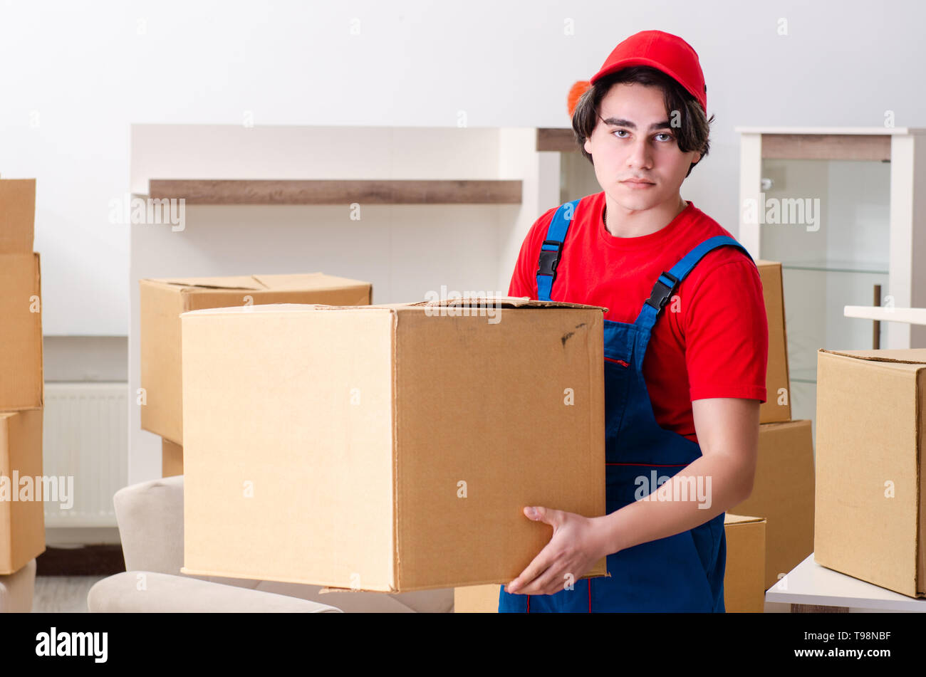 Young contractor boxes working hi-res stock photography and images - Alamy